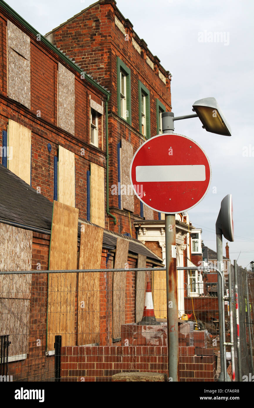 Boarded up building and no entry sign Stock Photo - Alamy