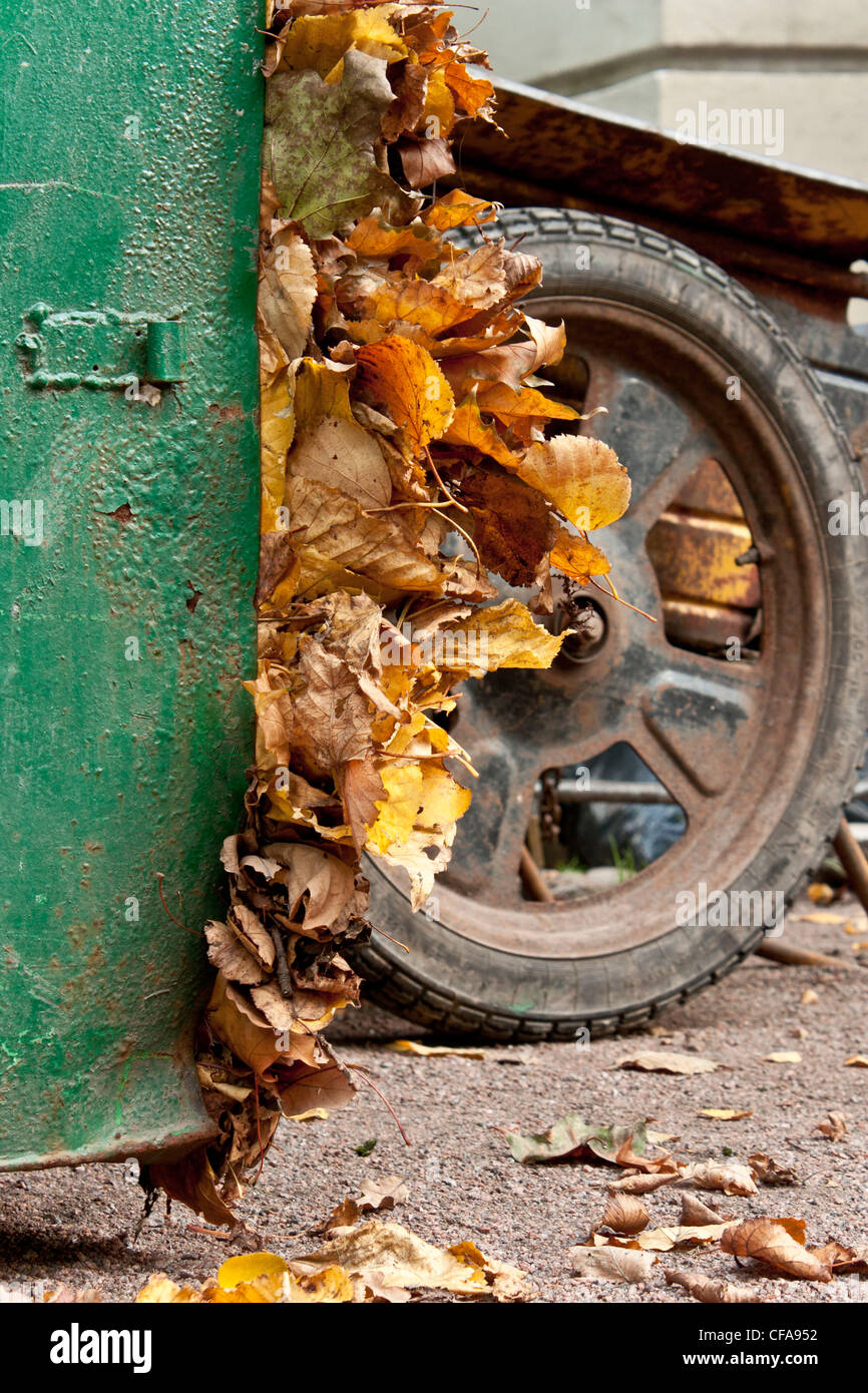 Yellow autumn leaves and cart wheel Stock Photo - Alamy