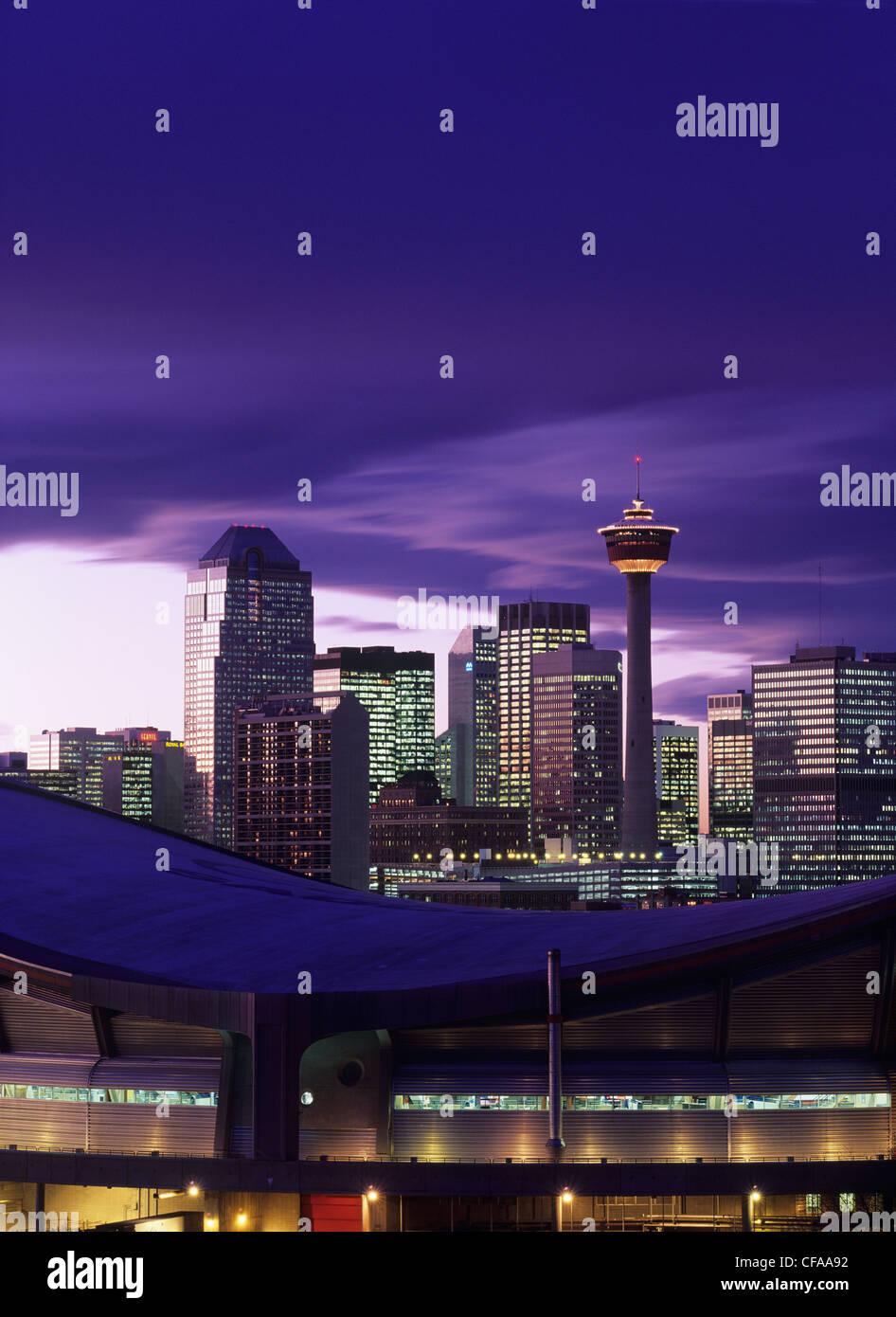 Calgary Skyline at dusk with the Pengrowth saddledome in forefront ...