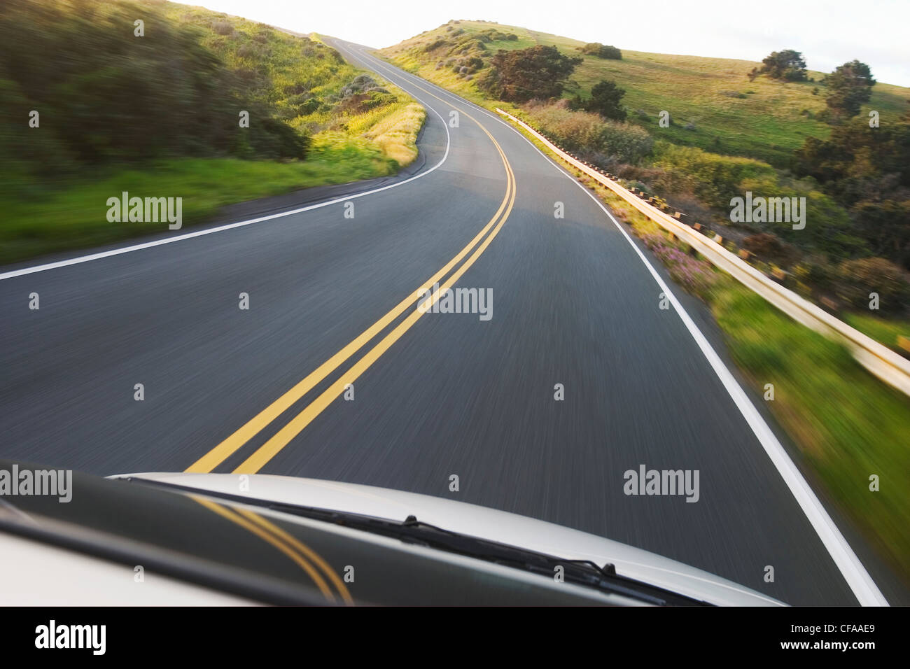 Car driving on country road Stock Photo - Alamy