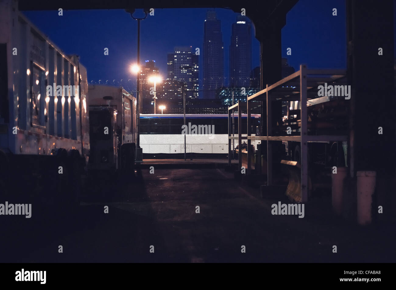 Containers at urban bus station at night Stock Photo - Alamy