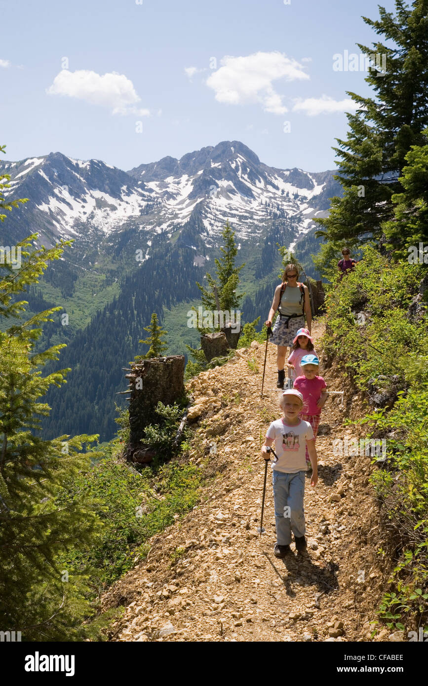 Two families hiking on trail at Island Lake Resort in the Lizard Range ...