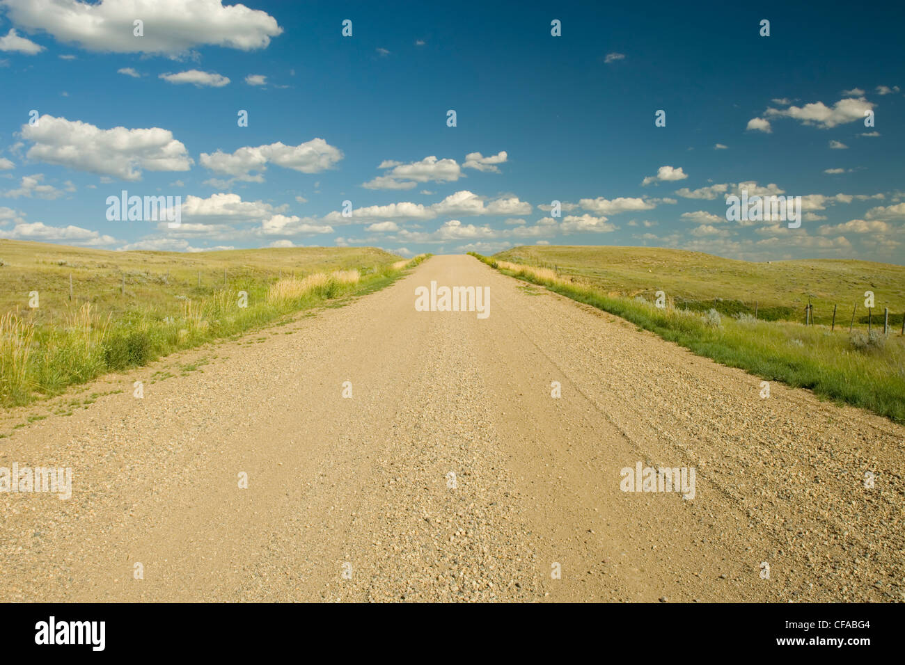Gravel road and wide open prairie, Great Sand Hills, Saskatchewan ...