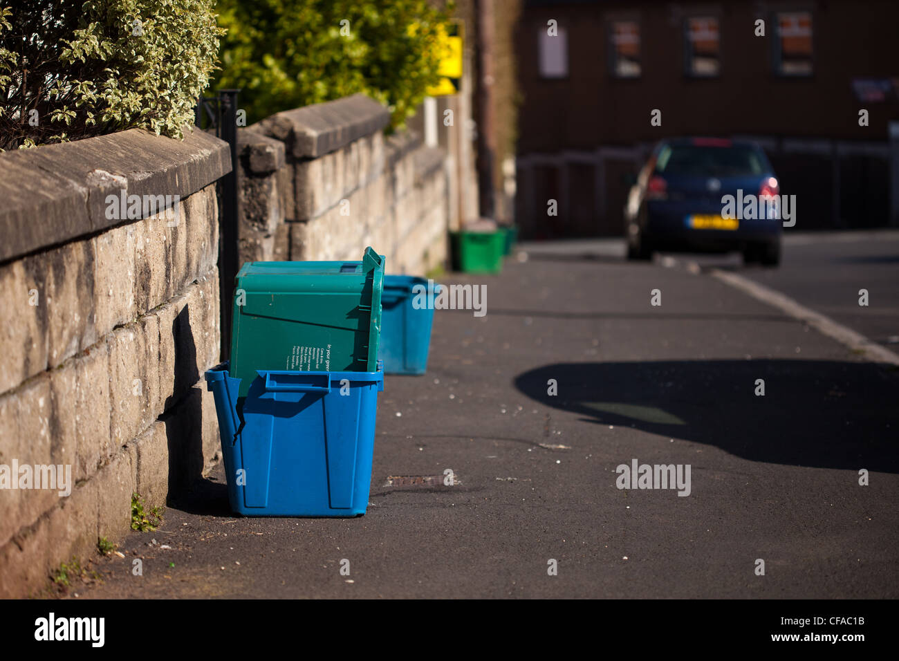 re-cycle bins on pavement after council collection Stock Photo - Alamy