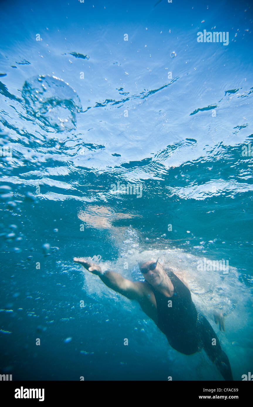 Swimmer training in ocean Stock Photo - Alamy