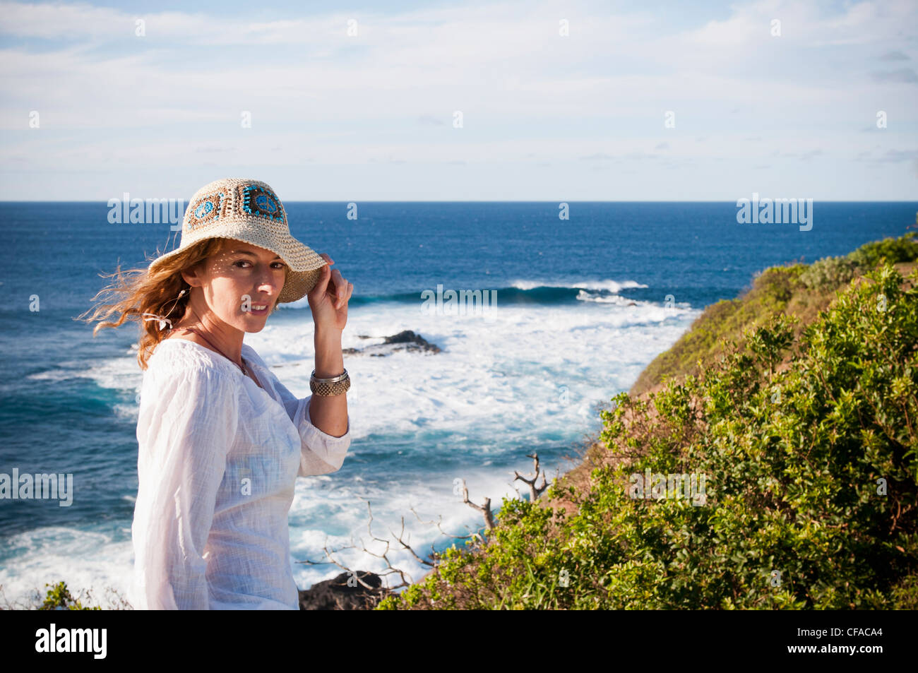 Woman standing on coastal cliffs Stock Photo - Alamy