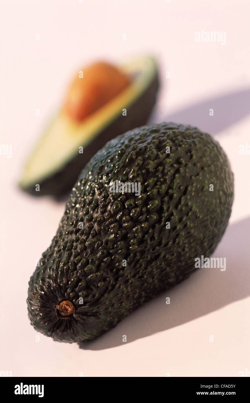 Still: avocado and half avocado with kernels Stock Photo - Alamy