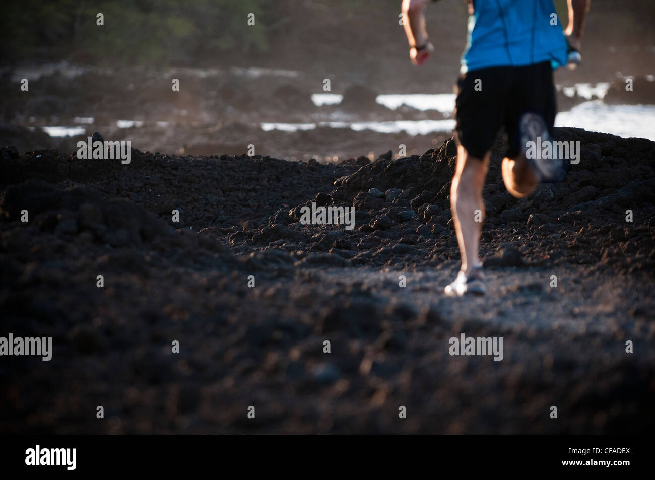 Black man jogging on beach hi-res stock photography and images - Alamy