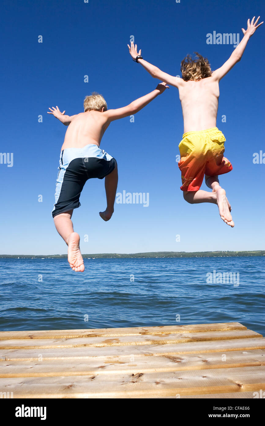 Kids Jumping Off Dock High Resolution Stock Photography and Images - Alamy