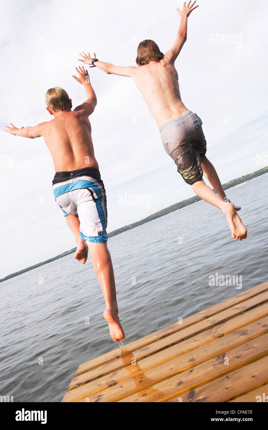 Kids Jumping Off Dock High Resolution Stock Photography and Images - Alamy