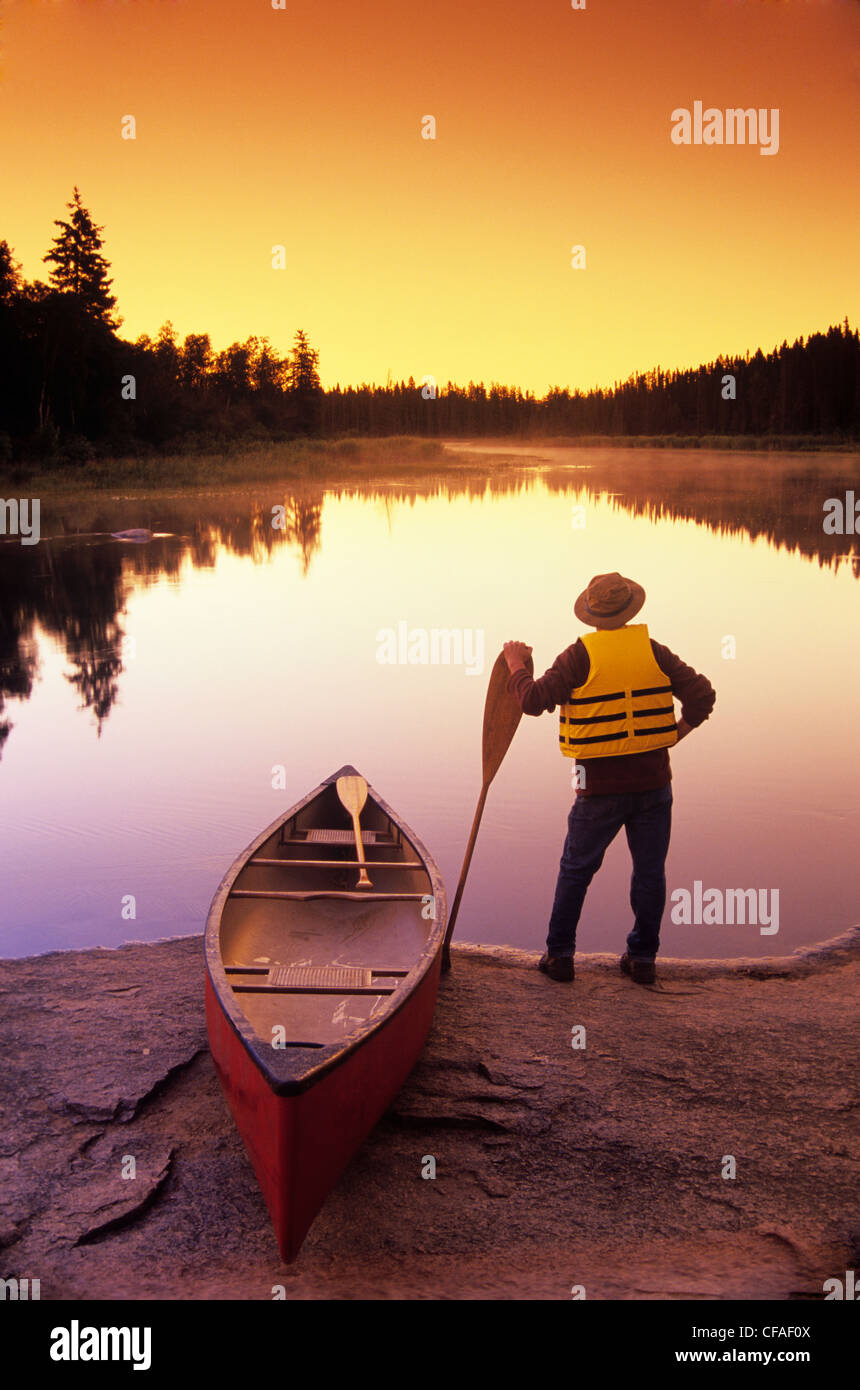 Canoeist along Whiteshell River, Whiteshell Provincial Park, Manitoba ...