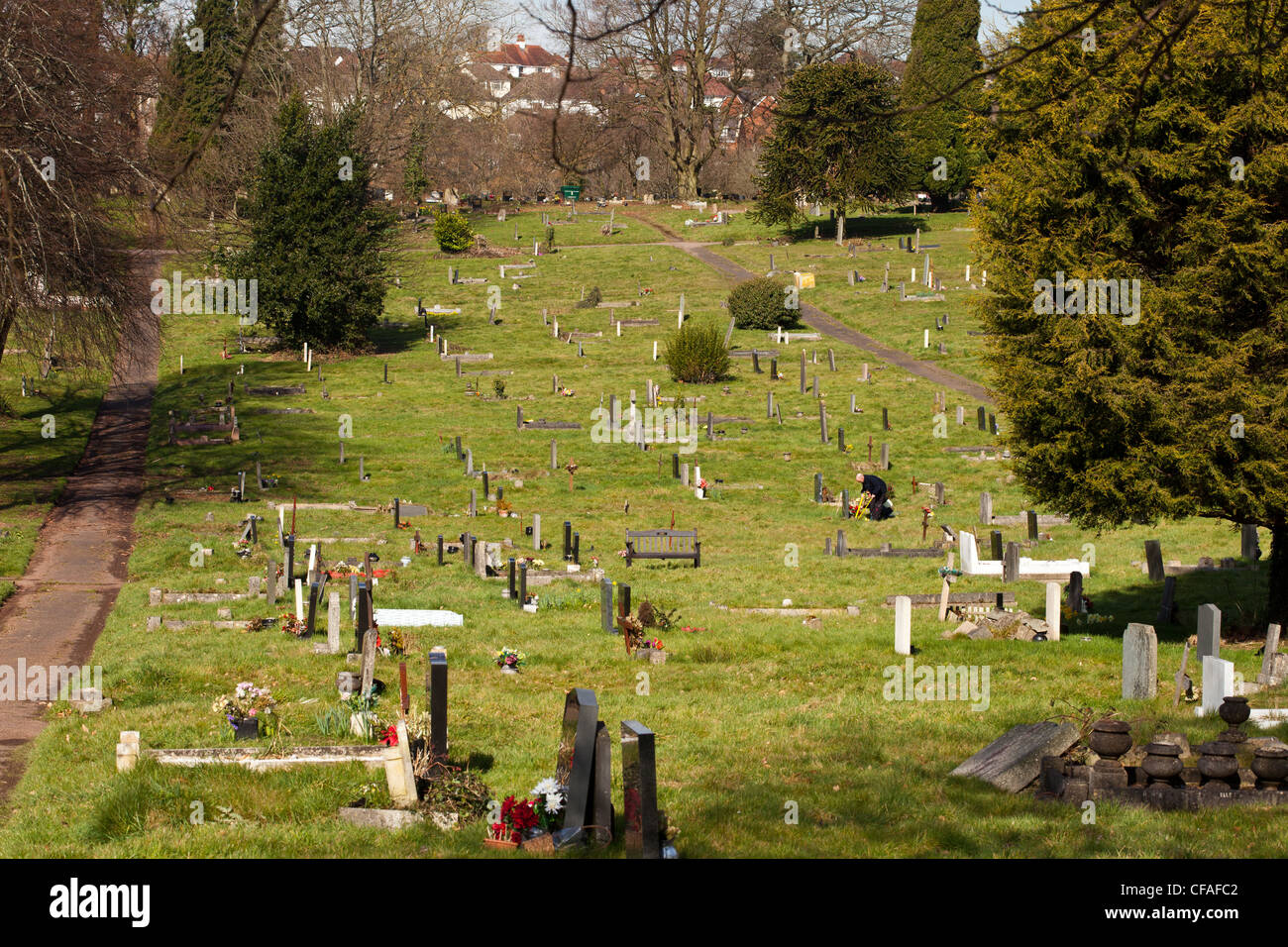 head stones in cemetery with fresh cut flowers,gravestones in graveyard ...