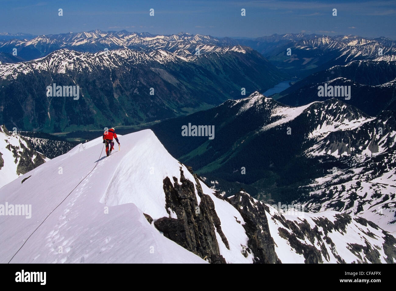 A climber heading off the summit of Mount Matier, Joffre Lakes ...