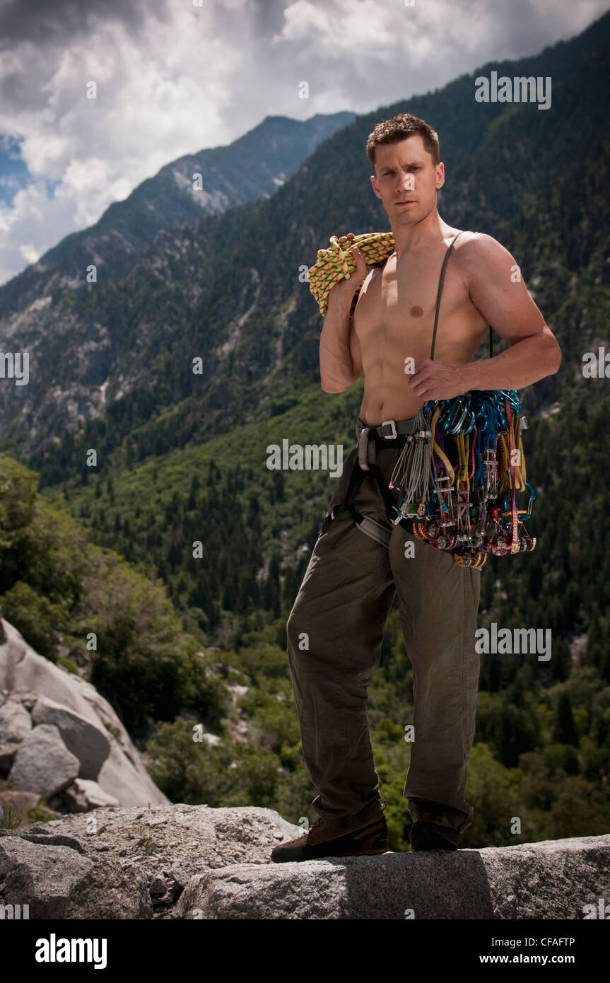 Climber carrying rope and carbines Stock Photo - Alamy