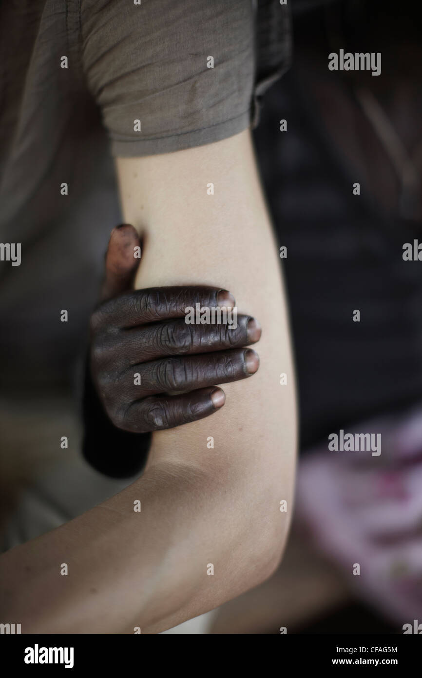 People of different ethnicities touching Stock Photo - Alamy