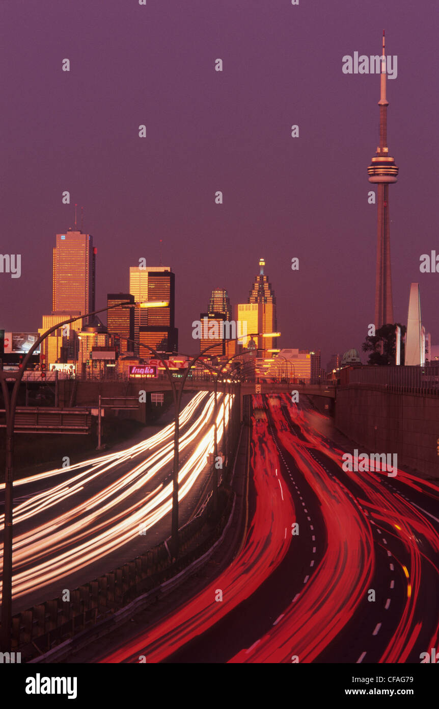 Dusk and rush hour traffic with skyline of Toronto, Ontario, Canada ...