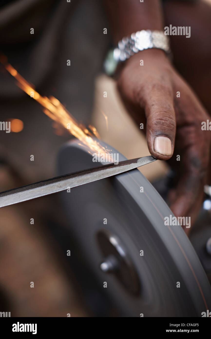 Close up worker sharpening knife hi-res stock photography and images ...