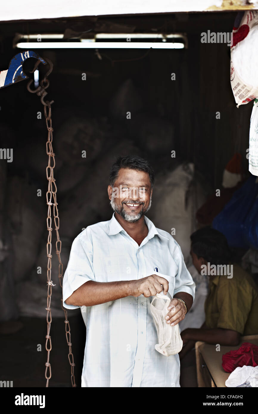 Smiling man shopping in outdoor market Stock Photo - Alamy