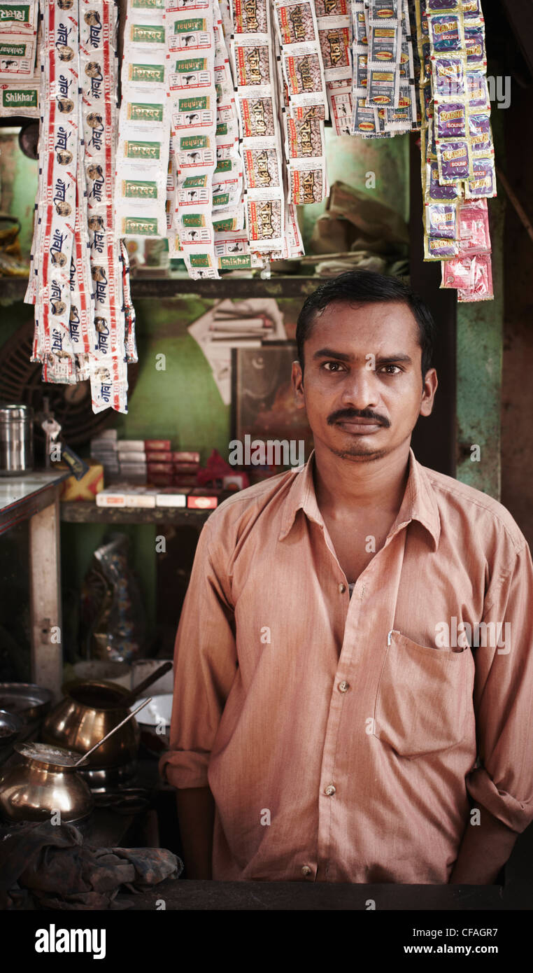 Man standing in kiosk Stock Photo - Alamy