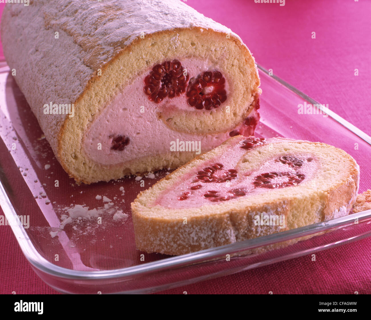 Sponge - roll with raspberry - cream Stock Photo - Alamy