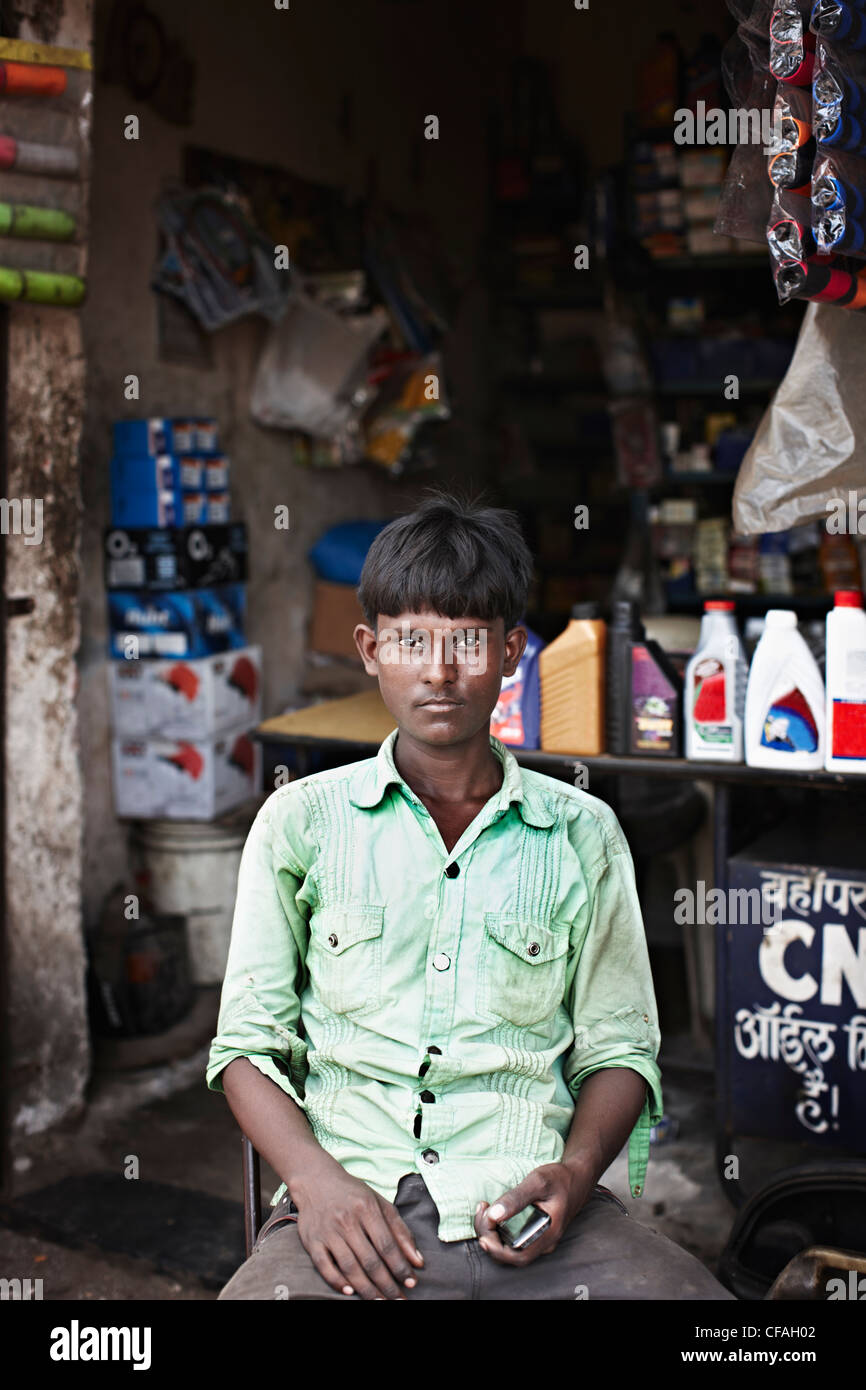 Man seated outside shop hi-res stock photography and images - Alamy