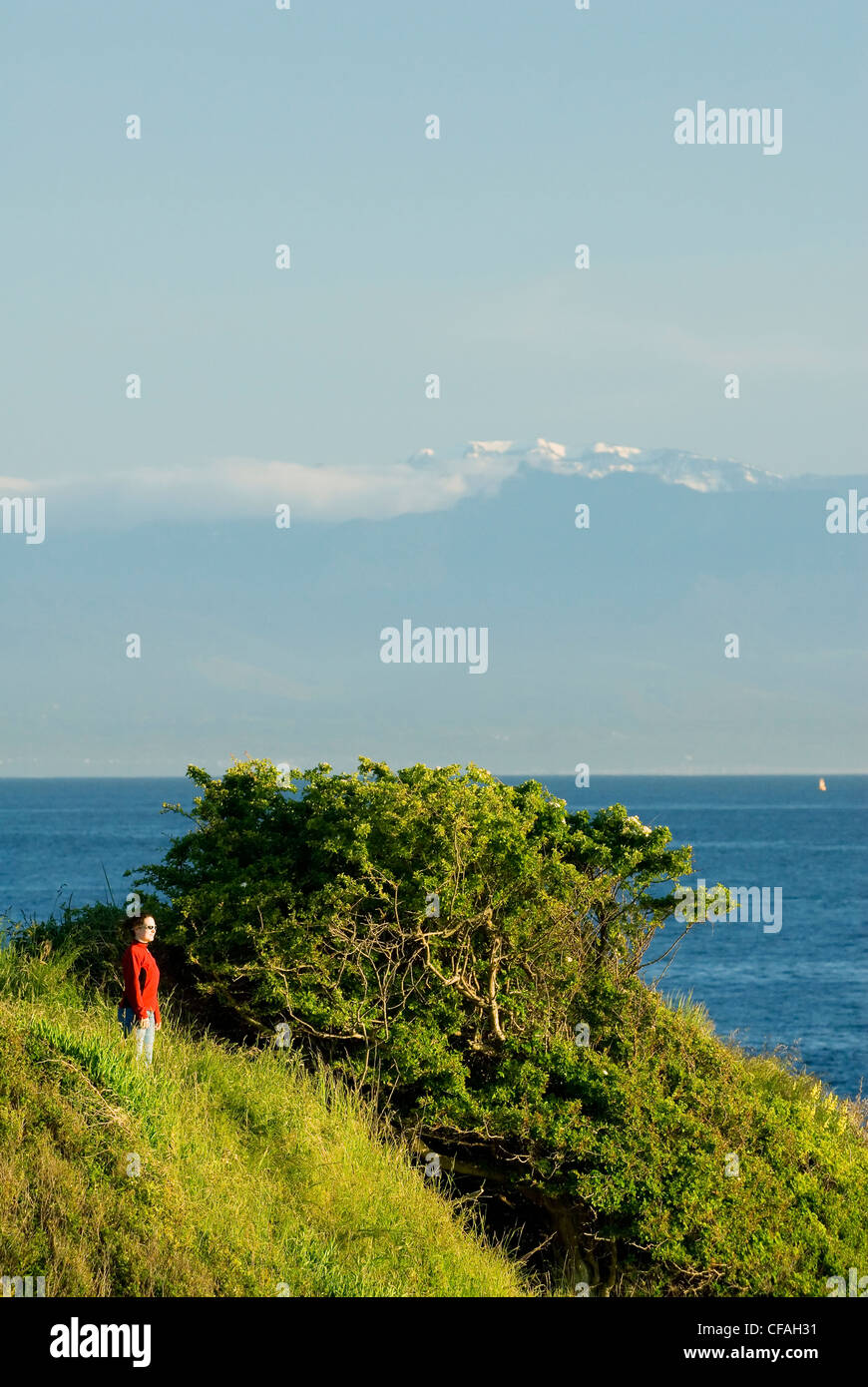 A woman enjoying the view along the Dallas Road waterfront in Victoria ...