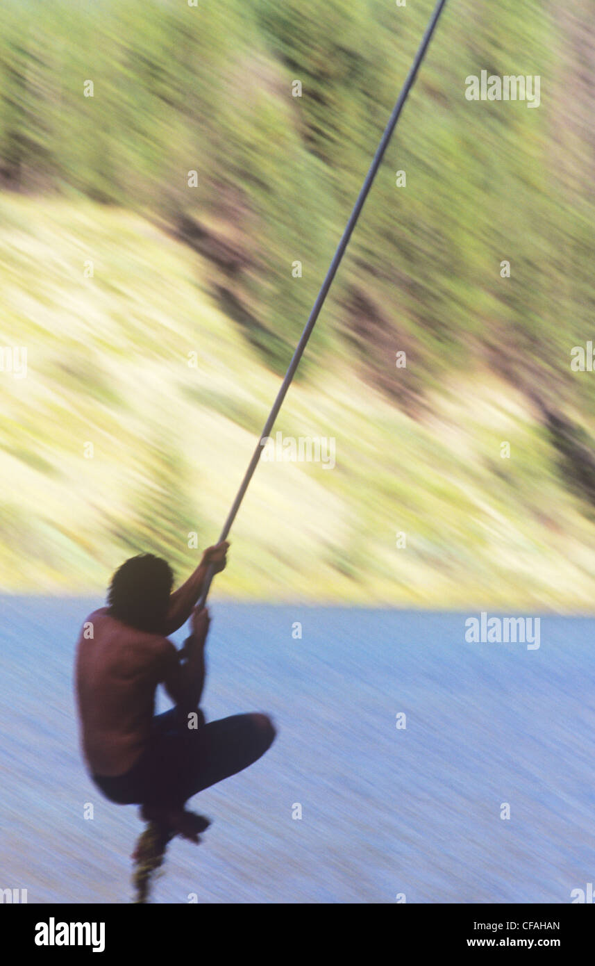 Man on rope swing, Banff, Alberta, Canada Stock Photo - Alamy
