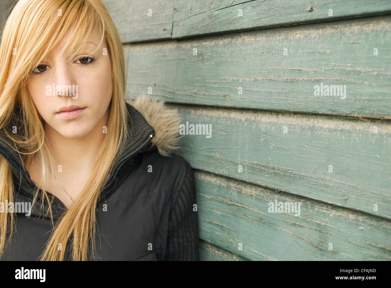 Caucasian female leaning against barn, Alberta, Canada Stock Photo - Alamy