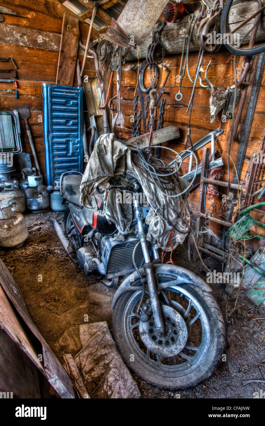 Close up of a dusty motorcycle in a storage barn Stock Photo - Alamy