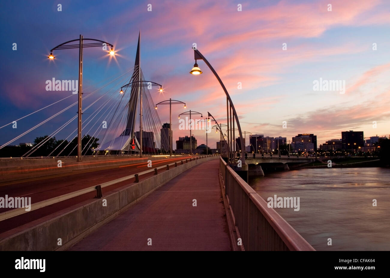 Winnipeg skyline with Esplanade Riel and Provencher Bridge over Red ...