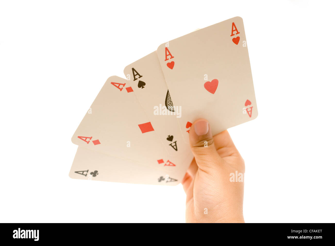 Hand holding four aces on white background Stock Photo - Alamy