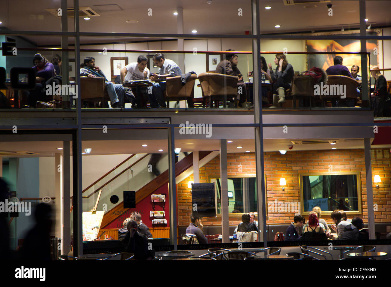 groups of people sitting at tables in café and bar at night Sheffield ...