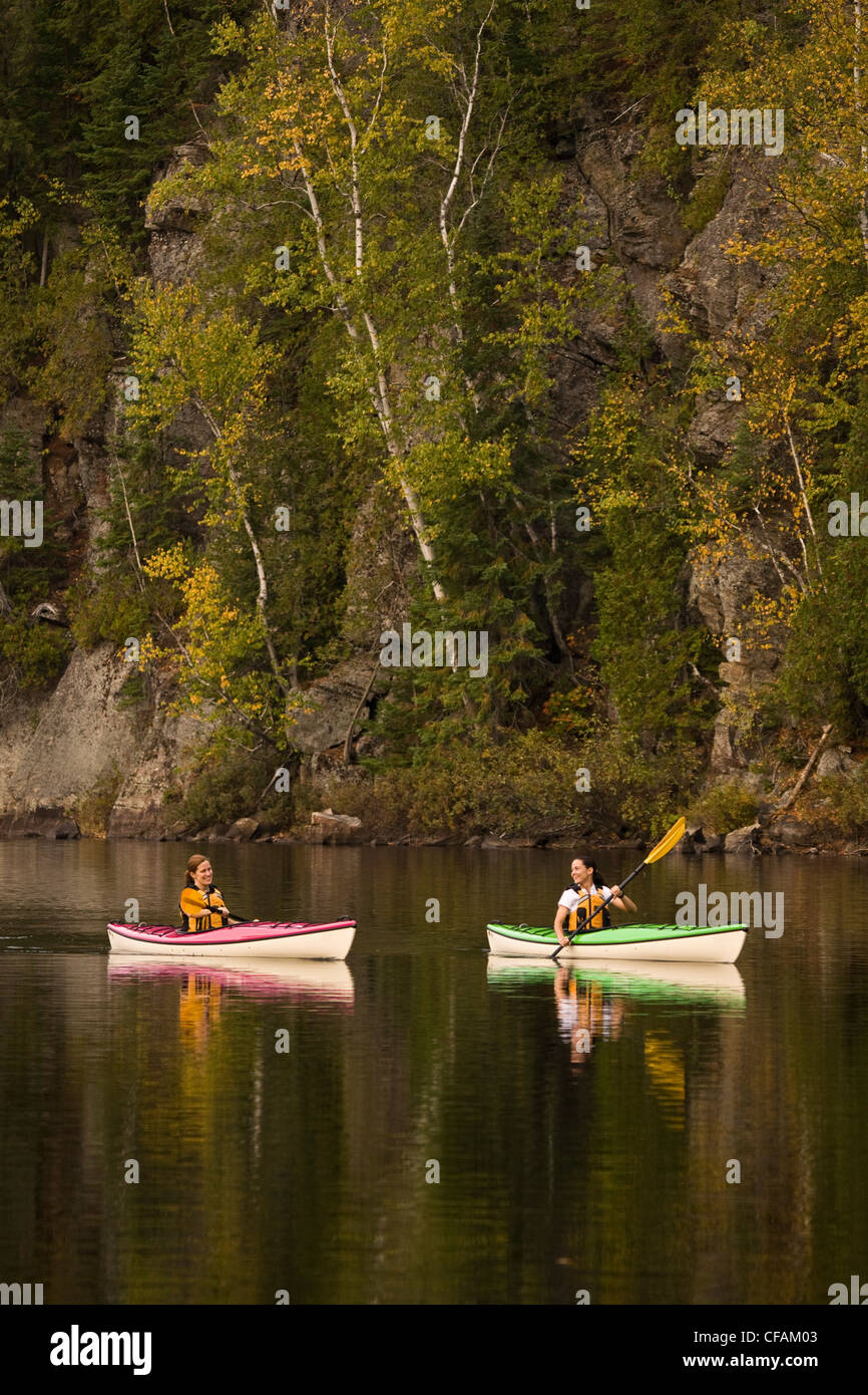 Two young women sea kayaking on muskoka lake hi-res stock photography ...