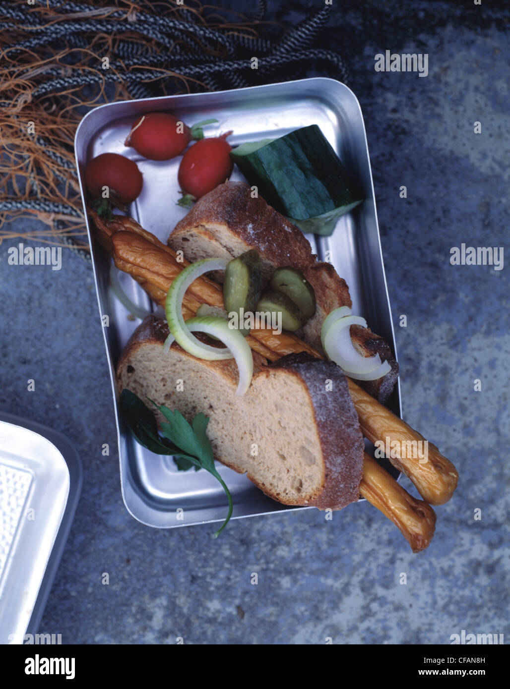 Still: fish breakfast (curled cured white fish stip and a slice of ...