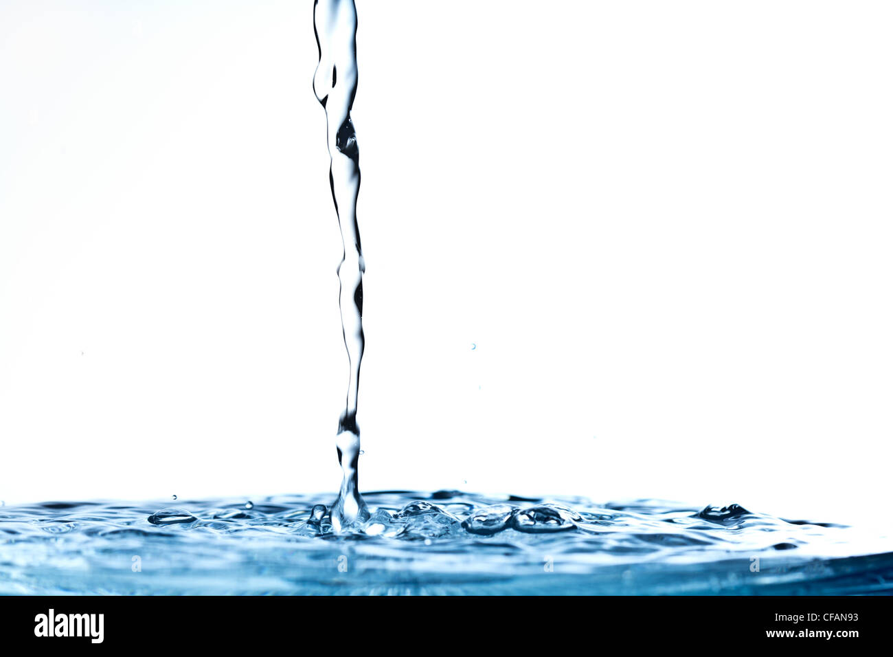 The fluid motion of water splashing as it is poured Stock Photo - Alamy