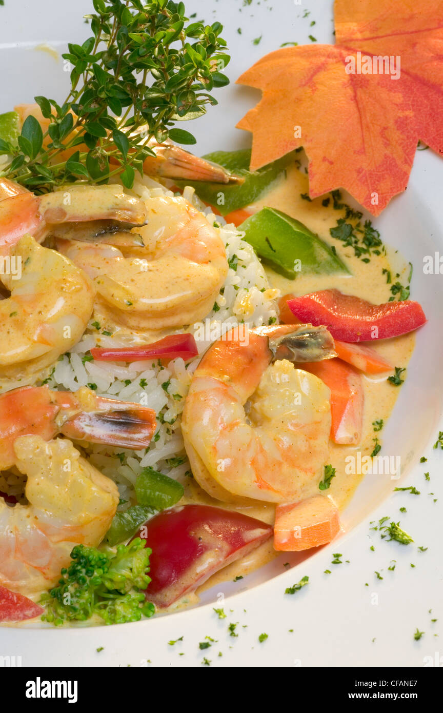 Plate of curried shrimp on rice Stock Photo - Alamy