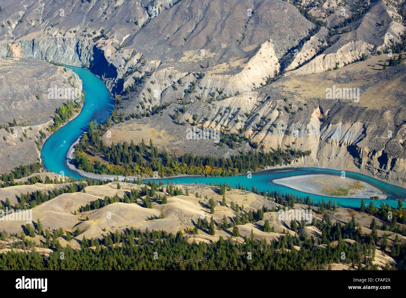 Aerial of Chilcotin River and grasslands in autumn of British Columbia ...