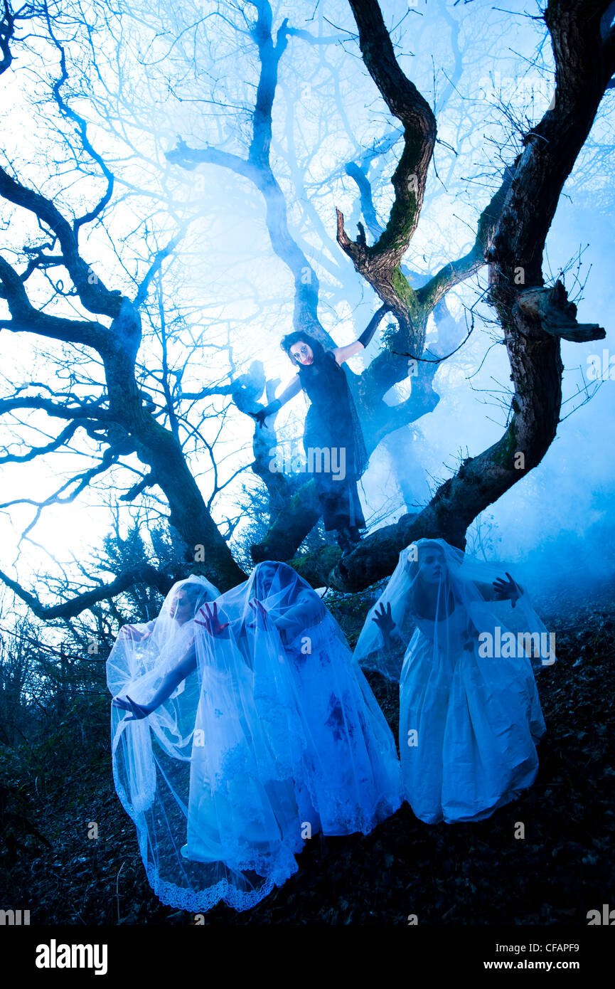 young women taking part in a Zombie bride 'trash the wedding dress' in ...