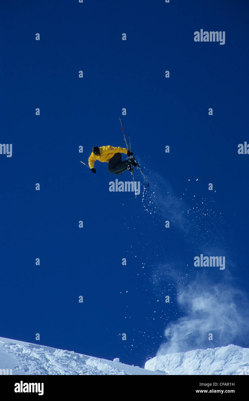 A skier catching air off a jump at Sunshine Village, Banff National ...