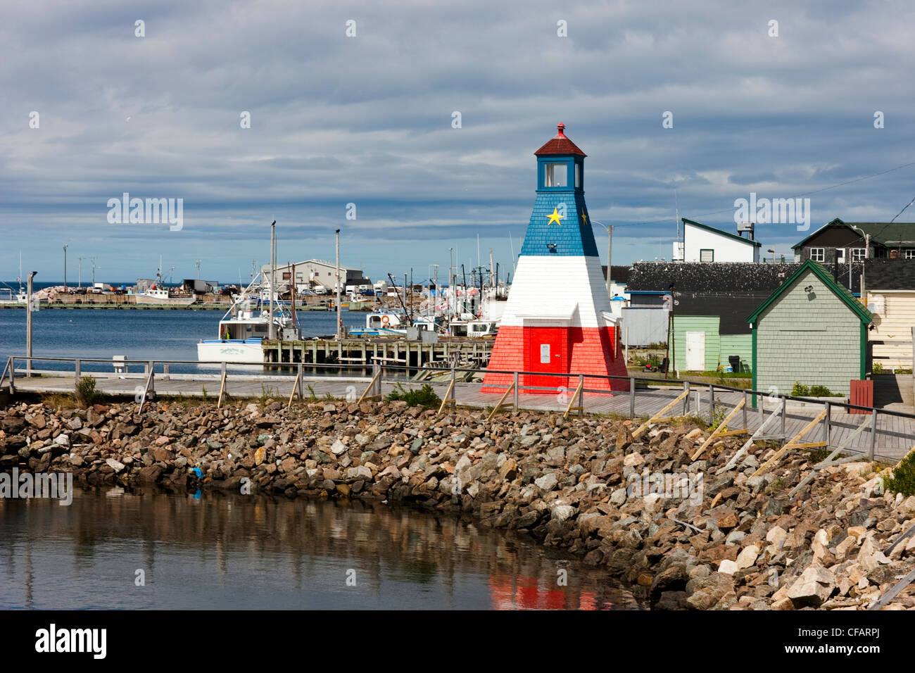 Acadian lighthouse on boardwalk along the Cheticamp waterfront, Cape ...