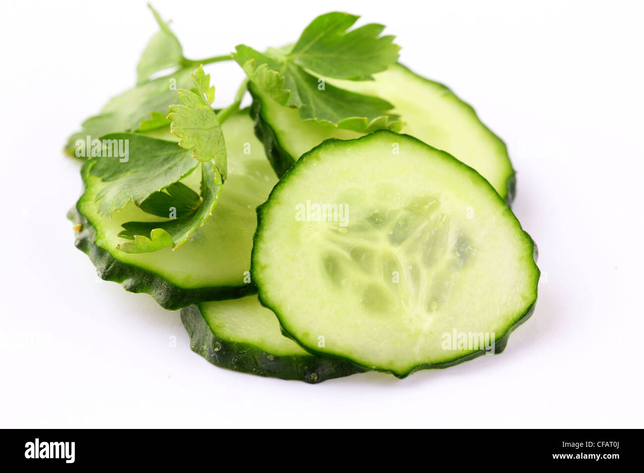 cut into slices of cucumber on white background Stock Photo - Alamy