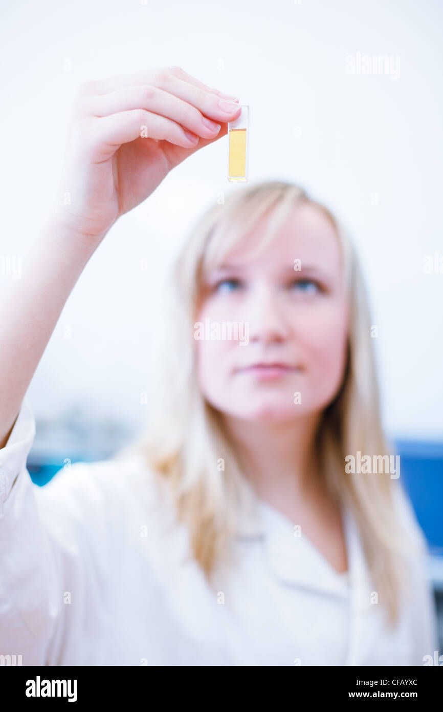 Closeup of a female researcher/chemistry student carrying out ...