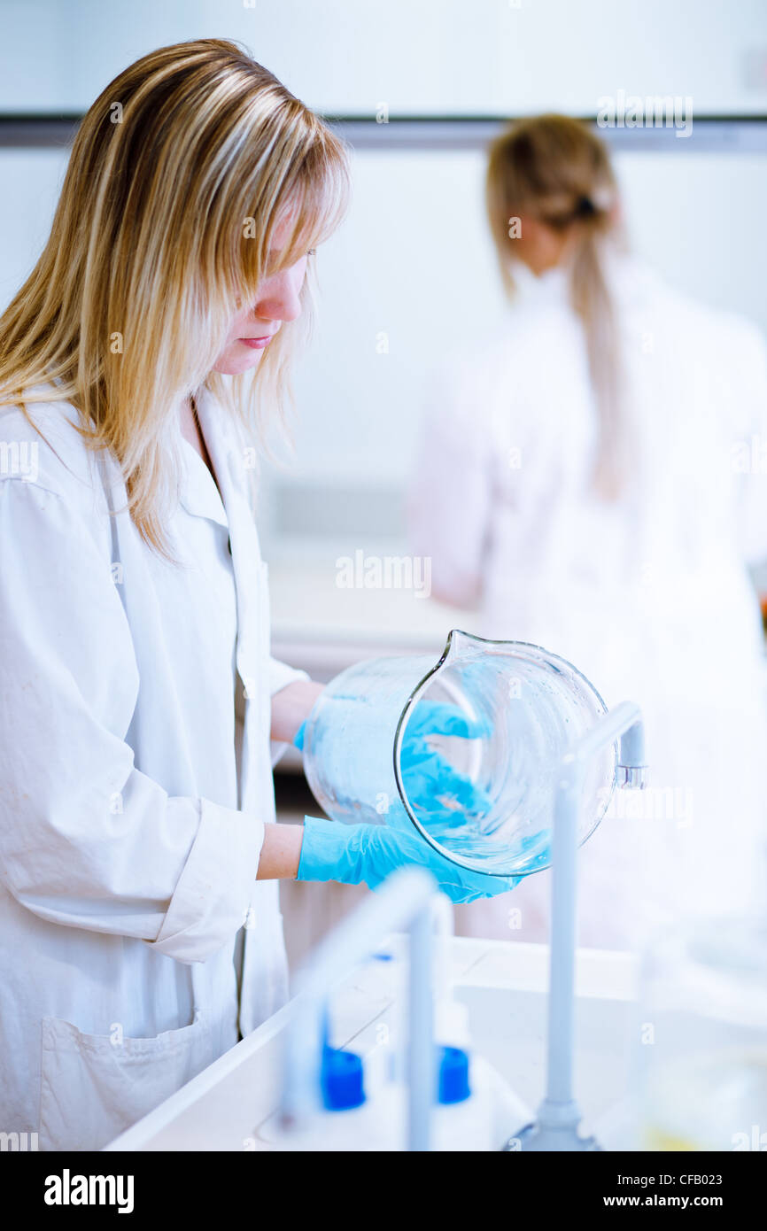 Closeup of a female researcher/chemistry student carrying out ...