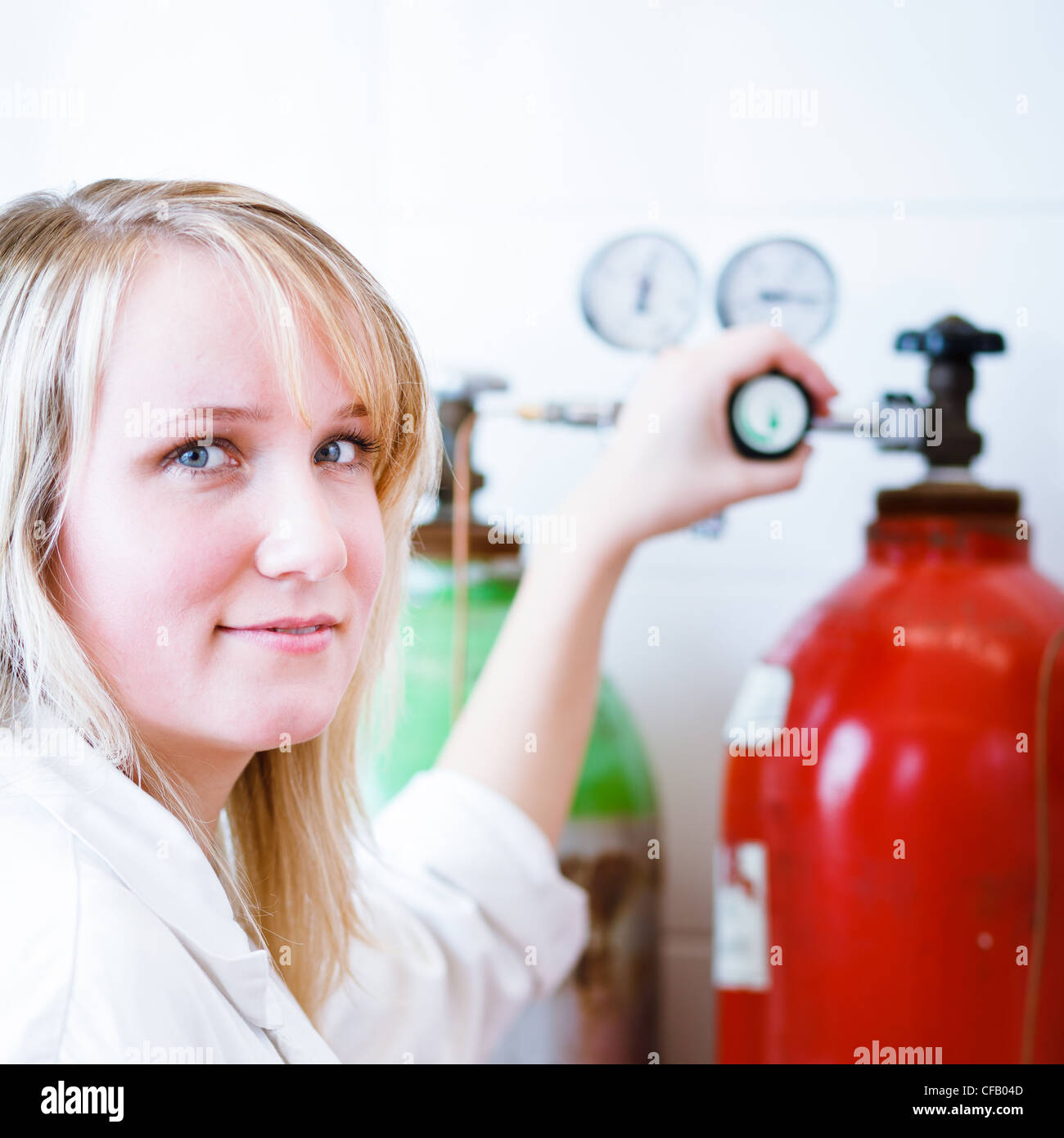 Closeup of a female researcher/chemistry student carrying out ...