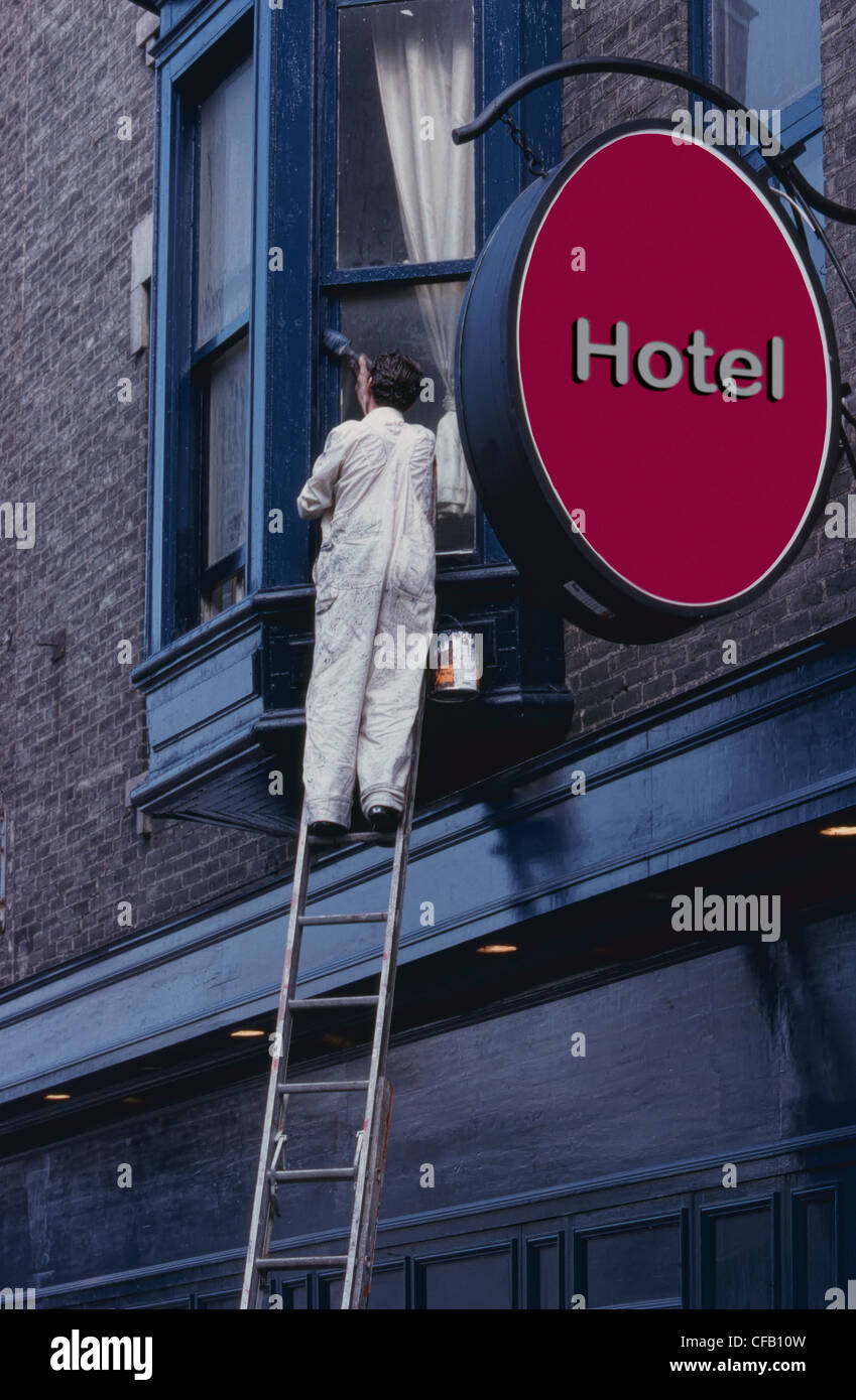 Man painting facade high rise building hi-res stock photography and ...