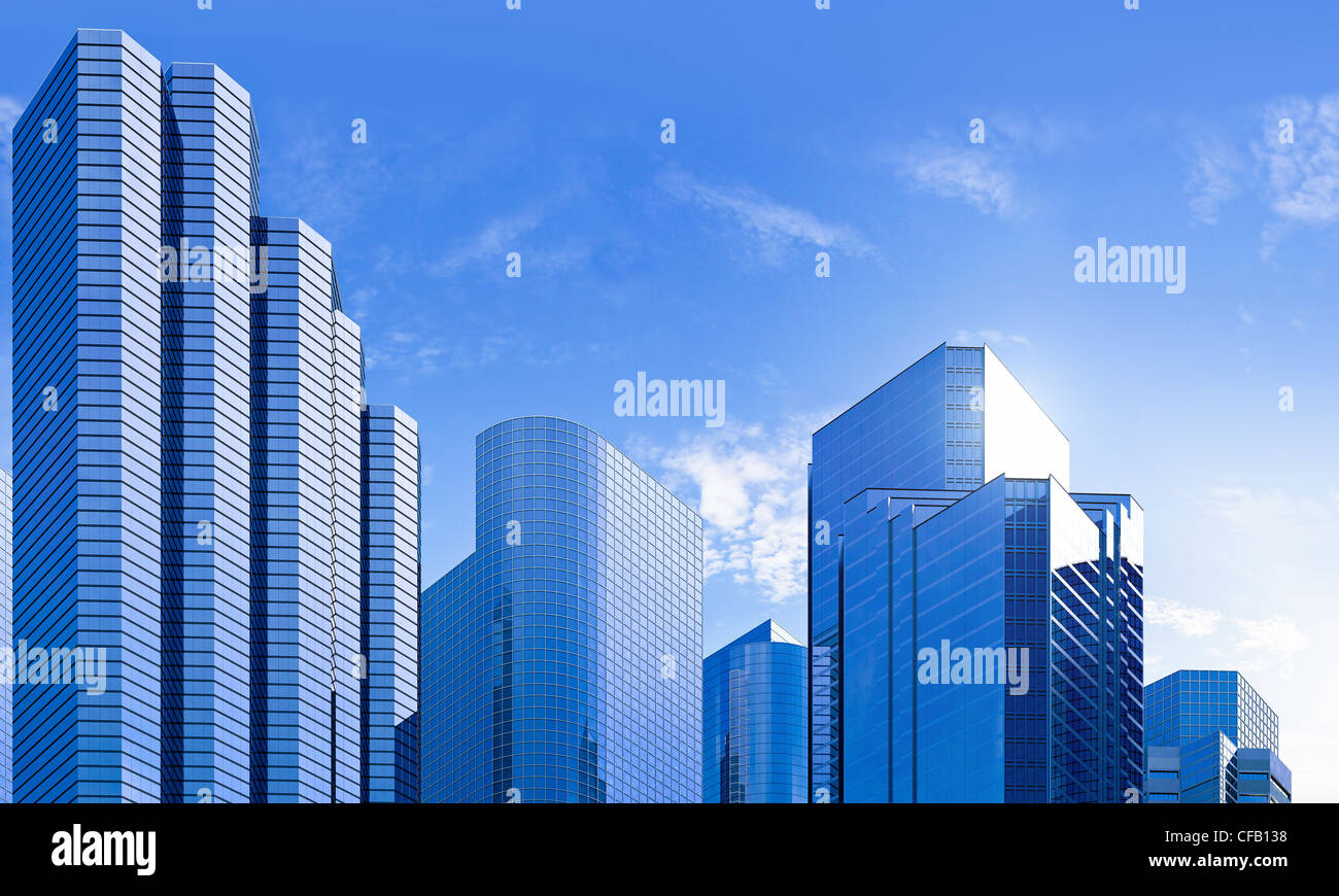 Glass skyscraper buildings skyline in blue dominant against a partially ...