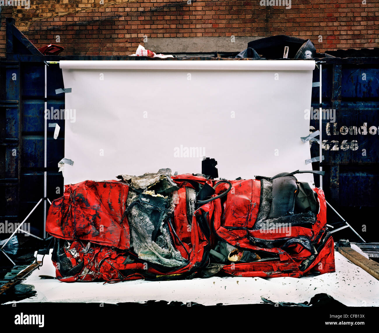 Crushed car on white background Stock Photo - Alamy