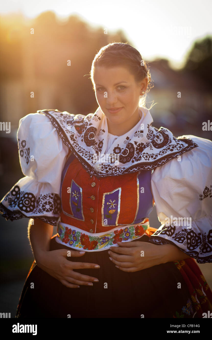 Young woman in a richly decorated ceremonial folk dress/regional ...