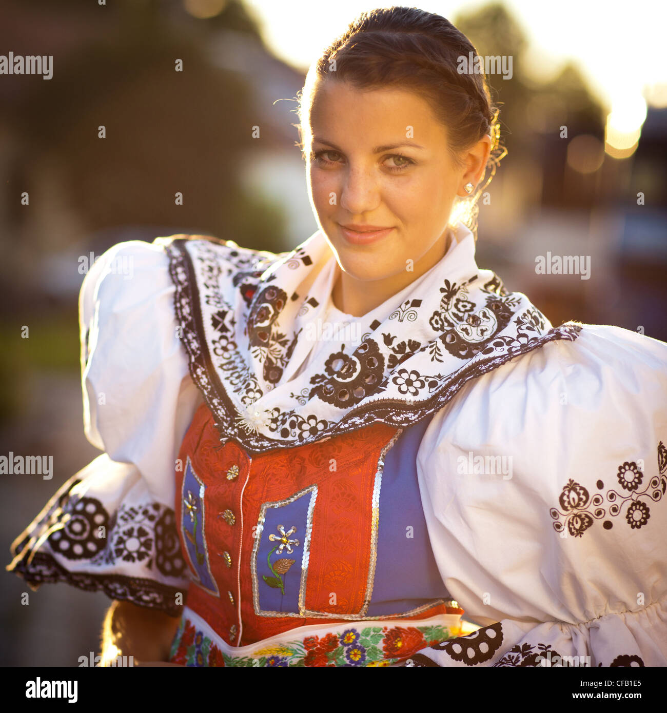Young woman in a richly decorated ceremonial folk dress/regional ...