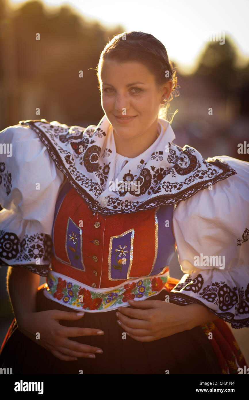 Young woman in a richly decorated ceremonial folk dress/regional ...